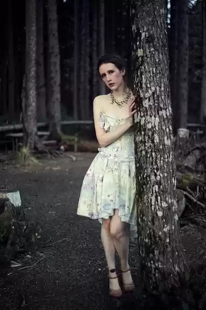 Scared Woman Dark Woods by OffiDocs for office