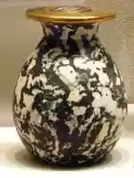 Variegated piriform jar and lid naming Thutmose